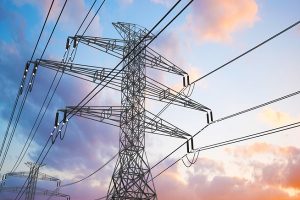 Electric Power Lines and Transmission Tower, Electric grid at sunset ...